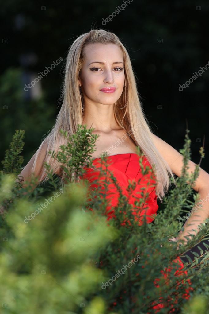 Lady in red outdoors — Stock Photo © gsdonlin #78311430