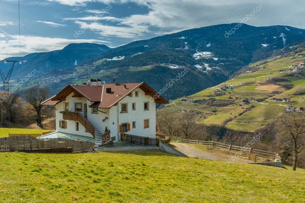 House next to the pasture on mountains background, Stock Photo by ...