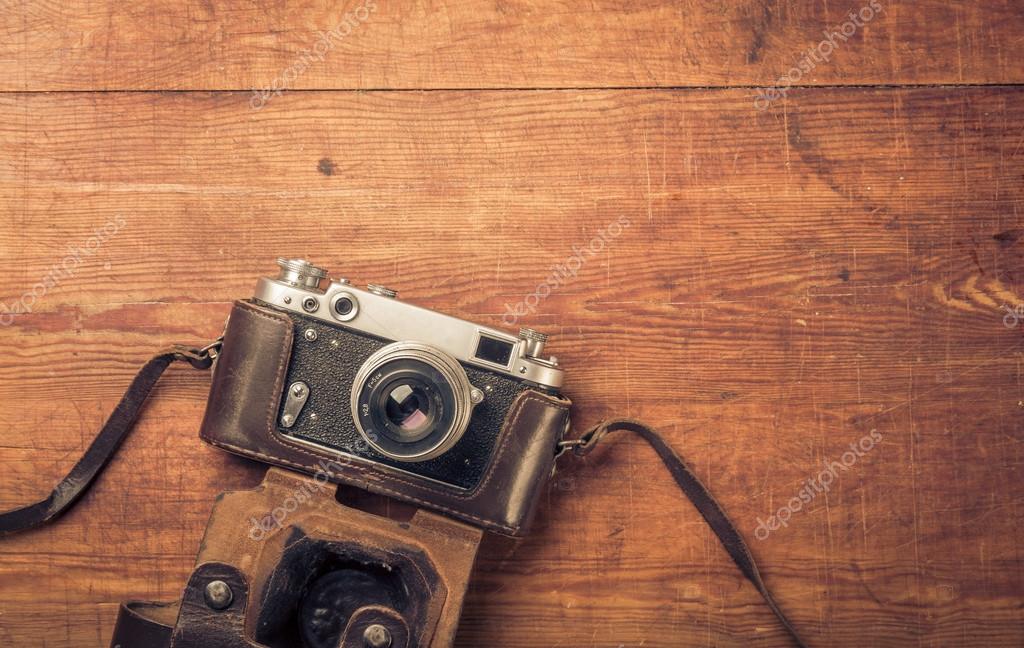 Retro camera on wood table background — Stock Photo © gilmanshin #92523632