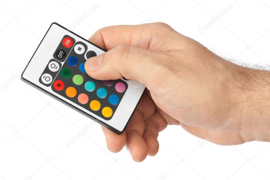 Remote control for change colors in hand — Stock Photo © Violin #69177817