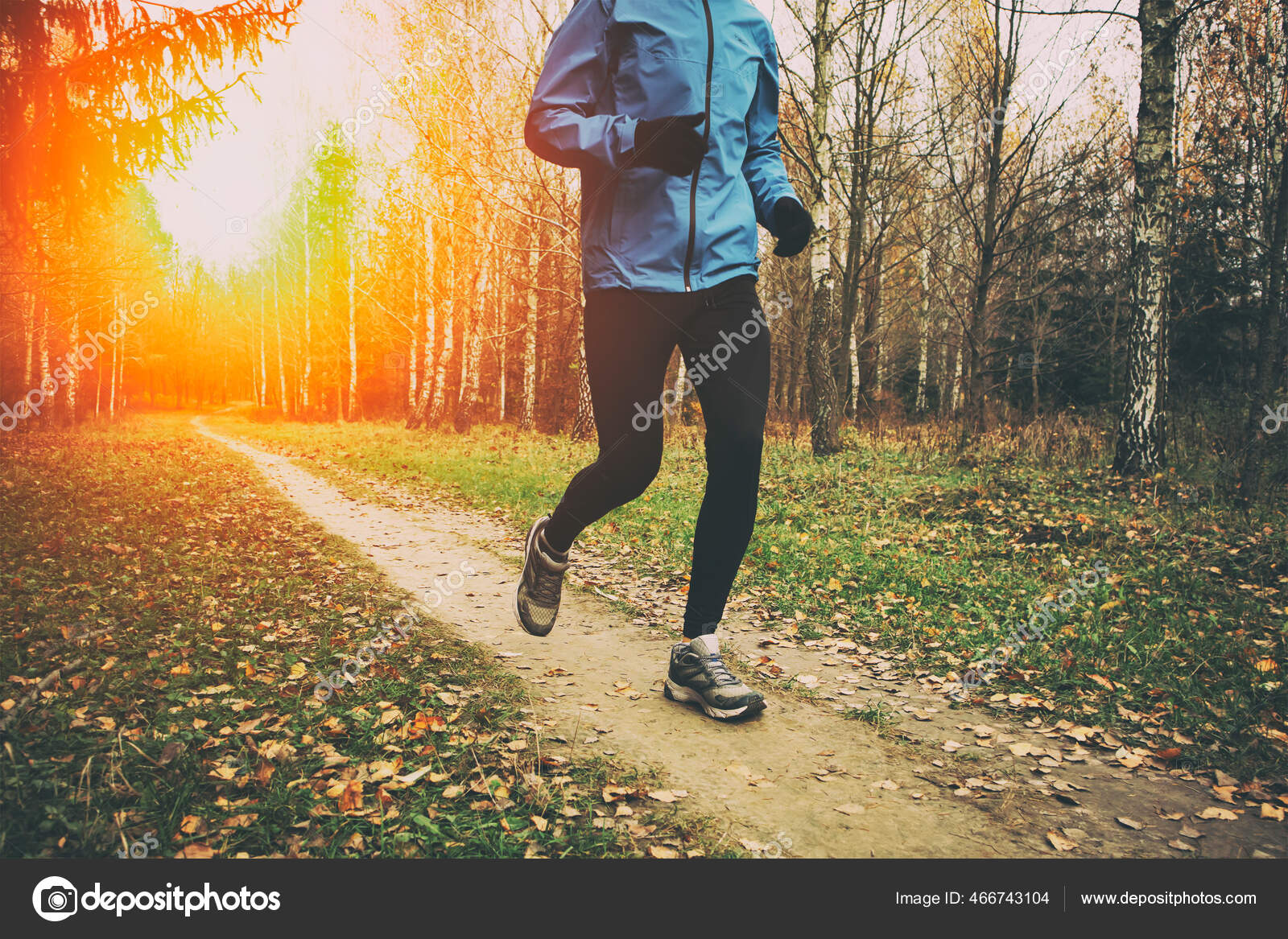 Young Man Running Autumn Park Pathway — Stock Photo © Olegkalina #466743104