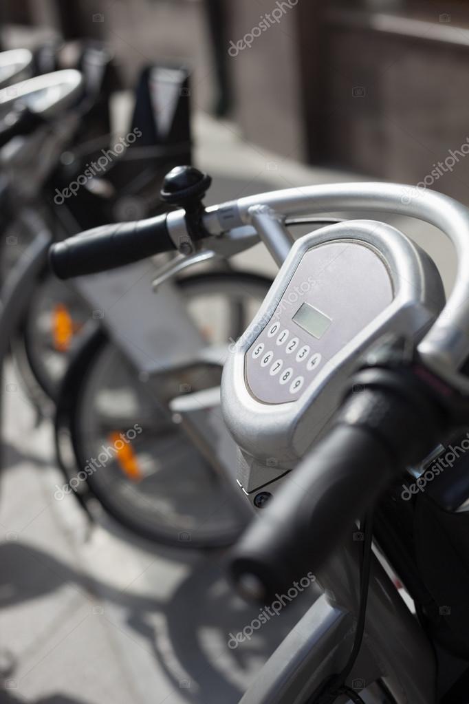 Rental bicycle pick up station in the city street Stock Photo by ...