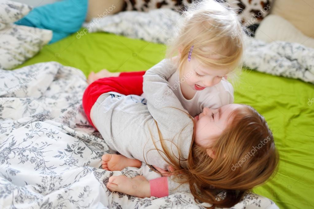 Two little sisters fooling around — Stock Photo © MNStudio #71617023