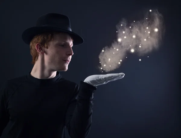 Magician holding something on palm of his hand — Stock Photo © Syda ...