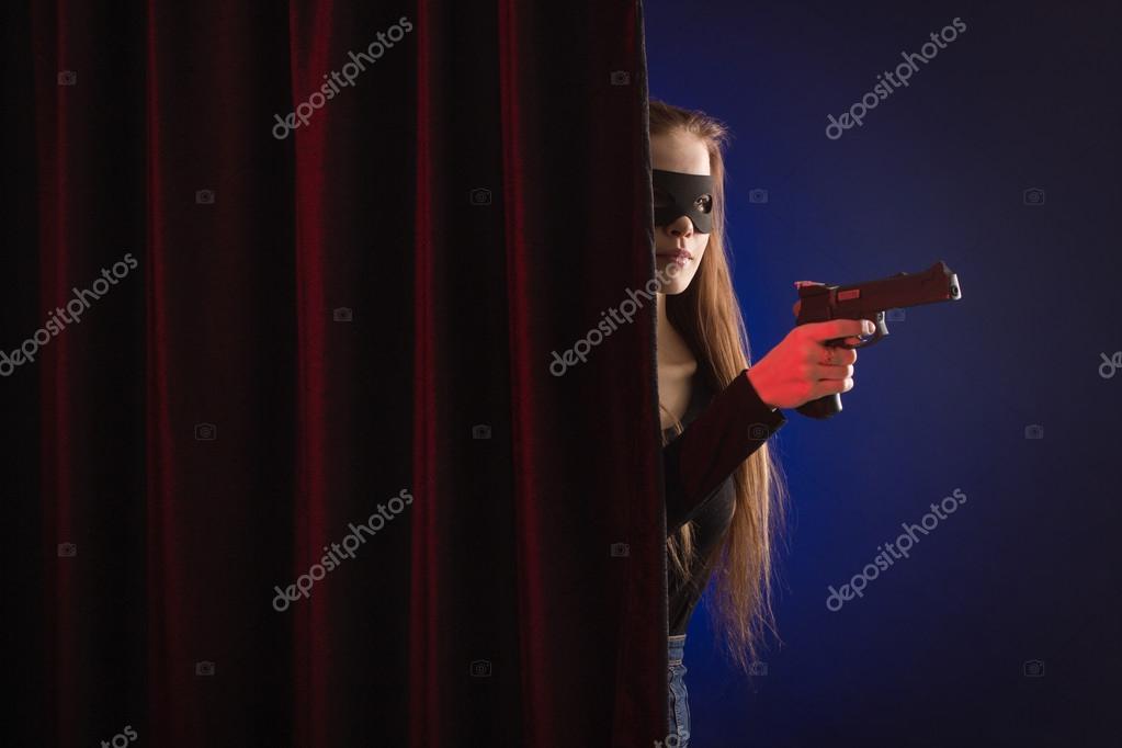 Masked robber with gun Stock Photo by ©papa42 67418099