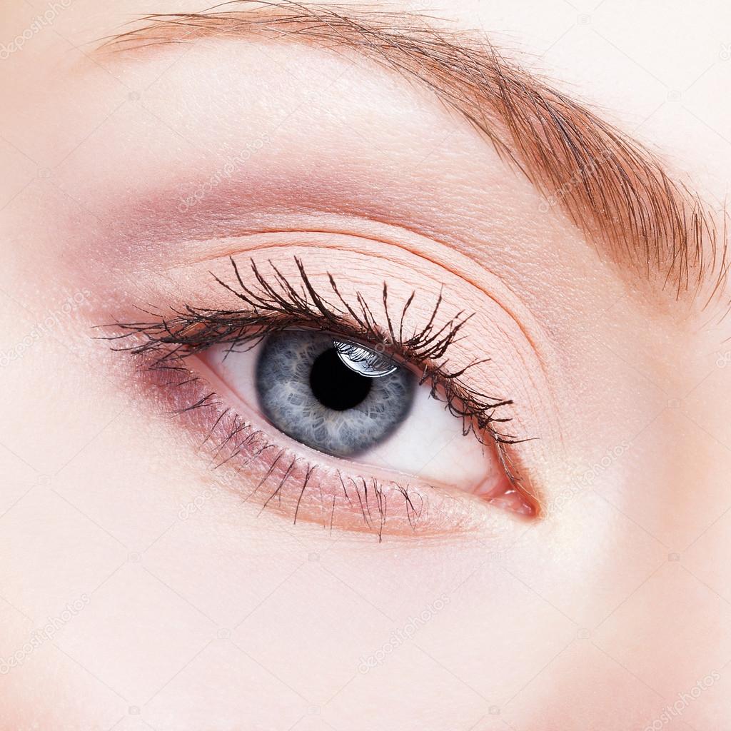 Female face makeup with blue eye Stock Photo by ©zastavkin 107996808