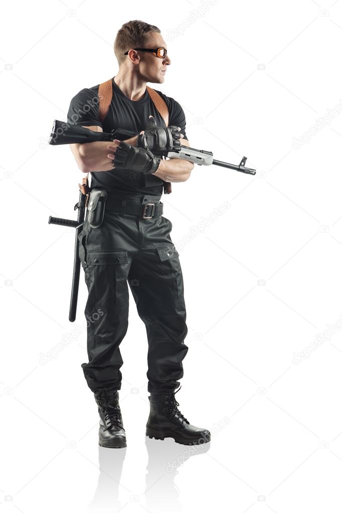 Police officer is holding Kalashnikov. Isolated on white. Stock Photo ...