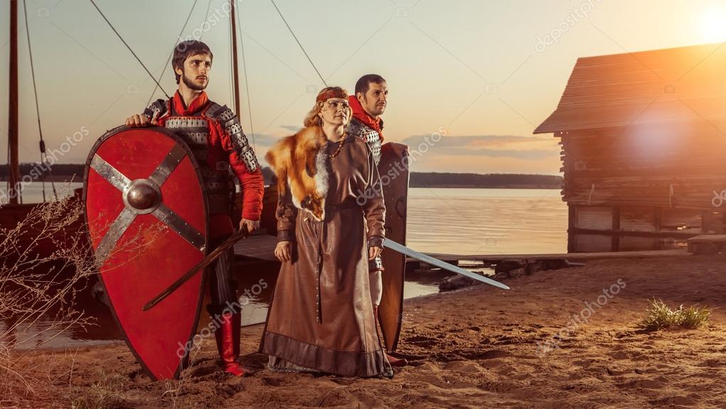 Slavic princess and two warriors with swords and shields on the ...