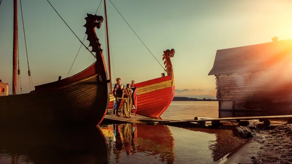 North princess and two warriors with swords on the sailing ships ...