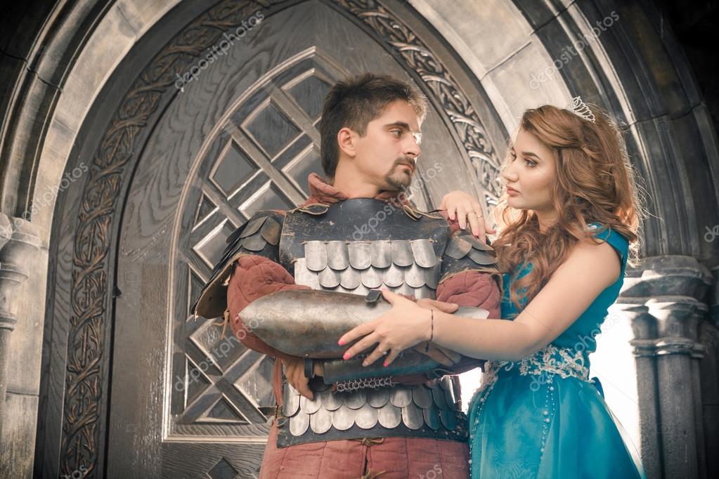 Medieval knight with his beloved lady. Stock Photo by ©bigdan 98834660