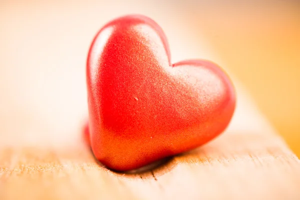 Single red hearts on wood for Valentine's Day. Stock Photo by ©valphoto ...