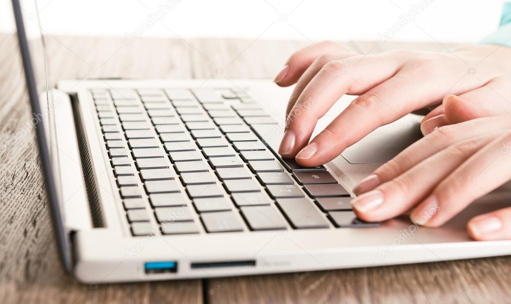 Hands typing on keypad Stock Photo by ©valphoto 64055657