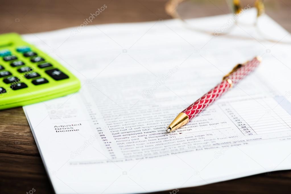 Calculating numbers for income tax return Stock Photo by ©valphoto 86613630 Calculating numbers for income tax return Stock Photo by ©valphoto 86613630