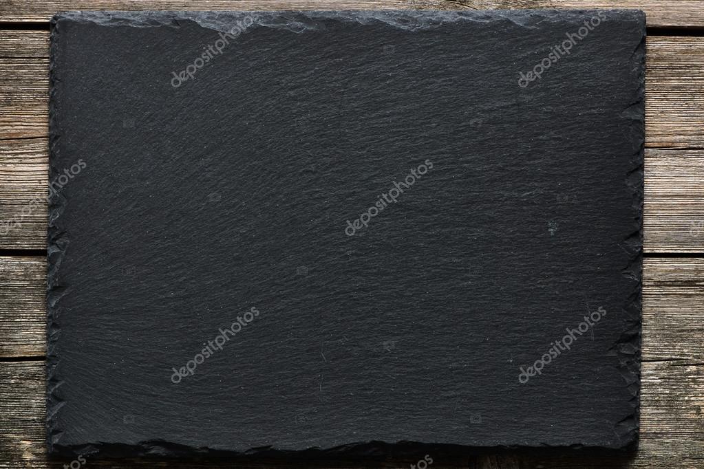 Slate on wooden background — Stock Photo © haveseen #86054676