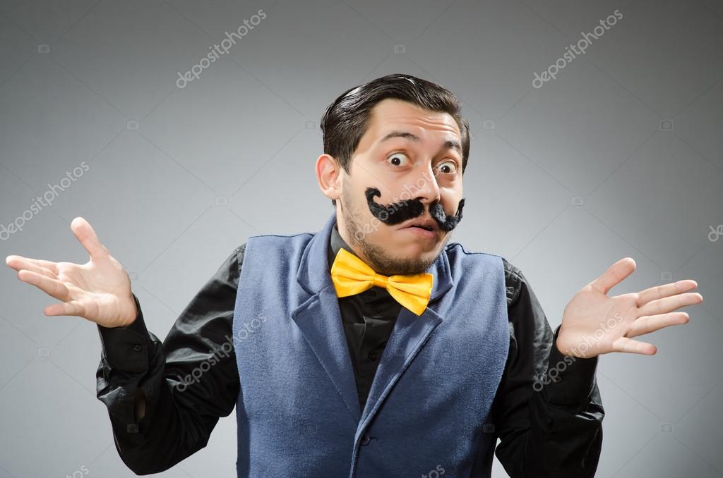 Funny man against dark background Stock Photo by ©Elnur_ 112243860