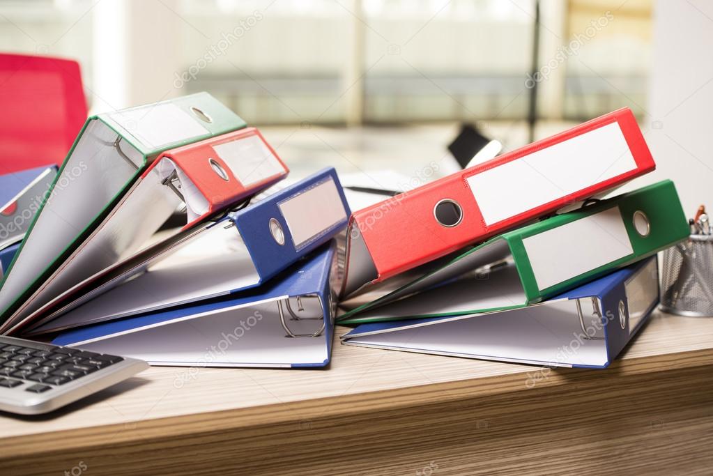 Stacks of office binders on desk Stock Photo by ©Elnur_ 114031360