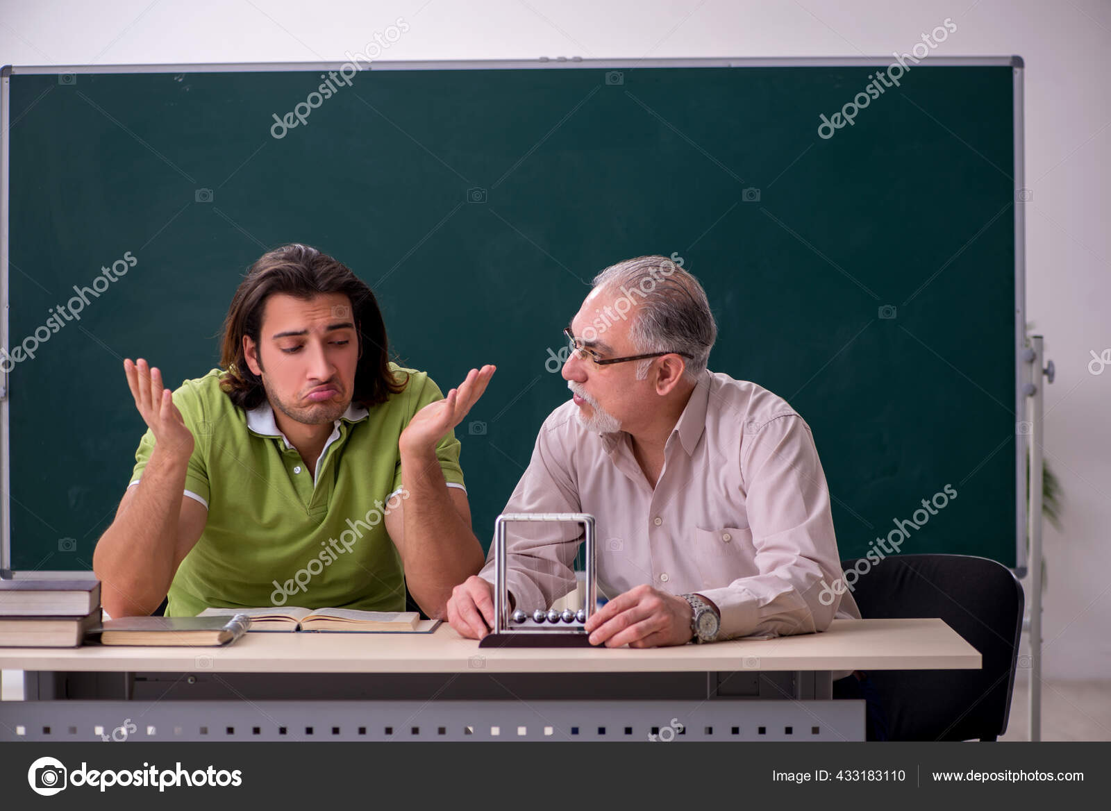 Old professor physicist and young student in the classroom Stock Photo ...