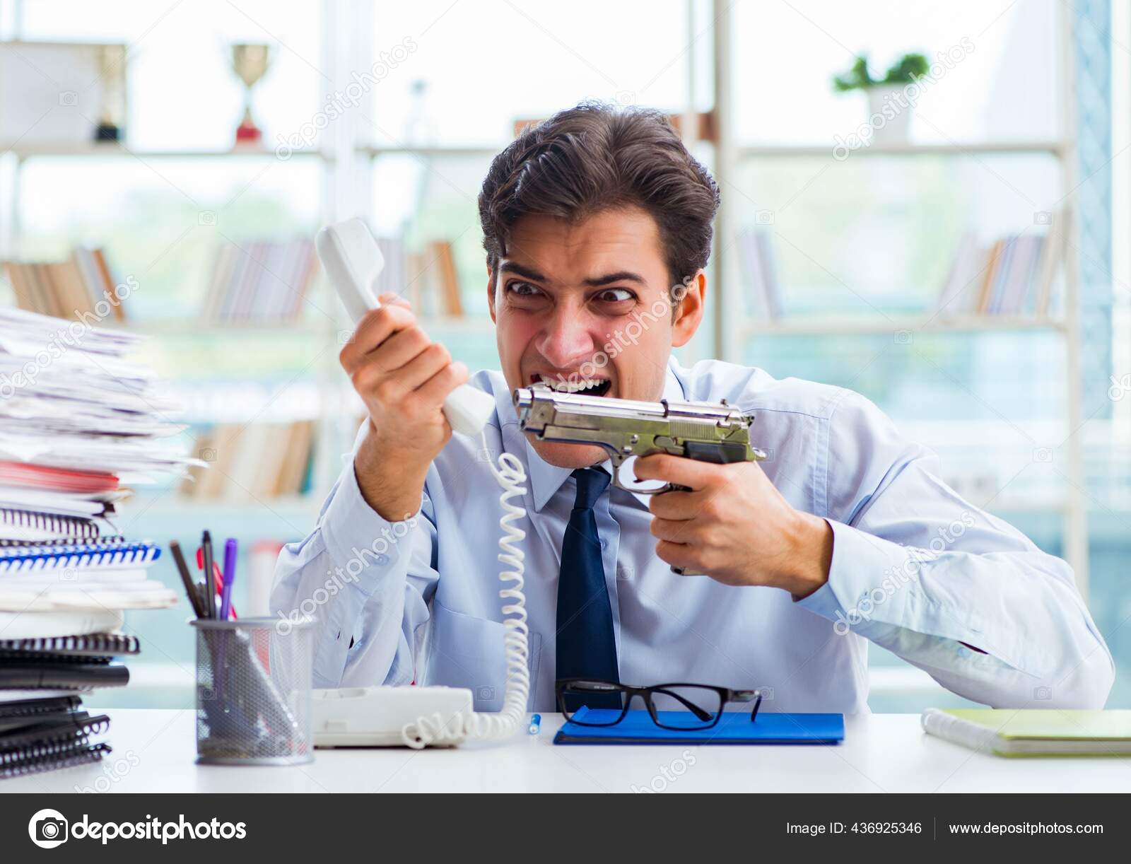 Angry businessman with gun thinking of committing suicide Stock Photo ...