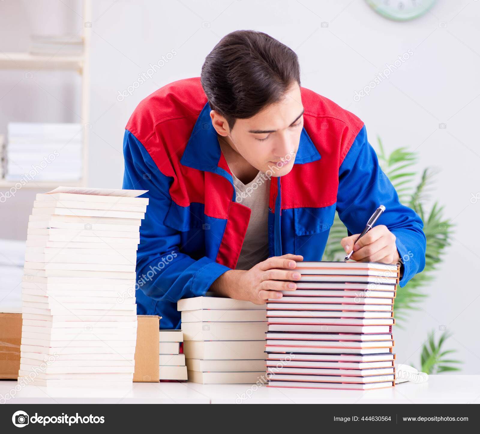 Worker in publishing house preparing book order — Stock Photo © Elnur ...
