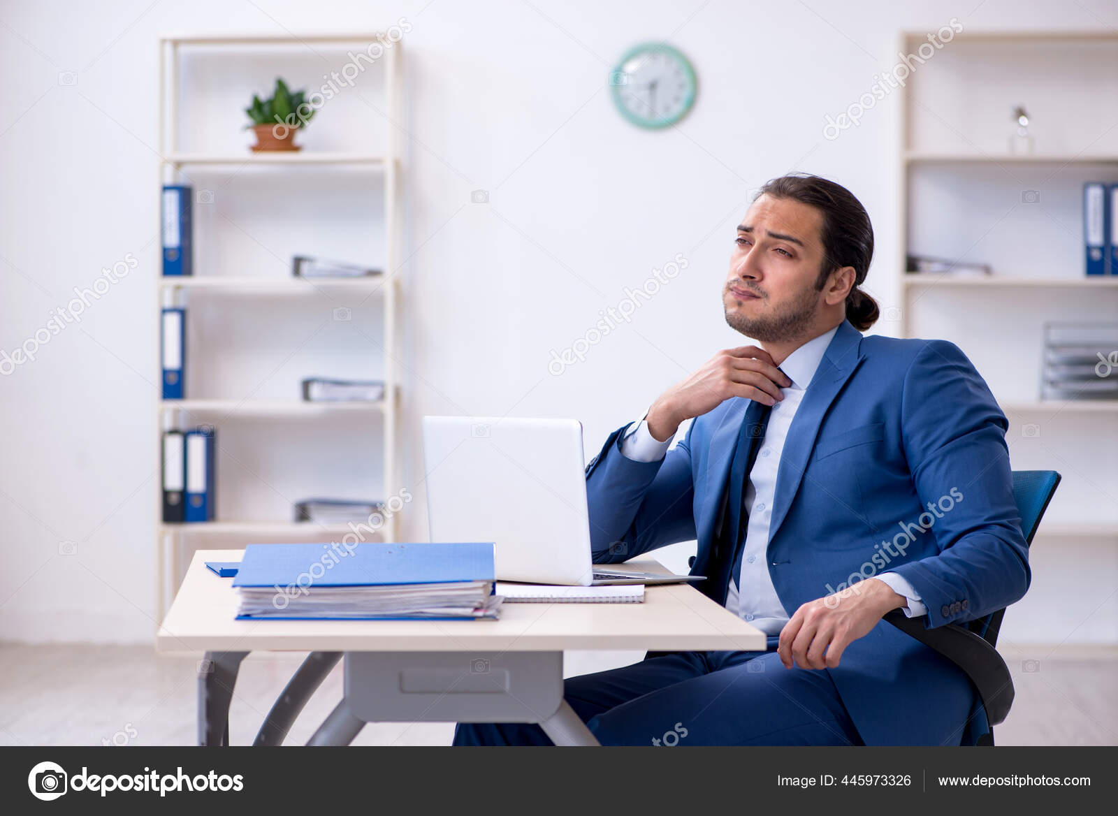 Young male employee working at workplace — Stock Photo © Elnur_ #445973326