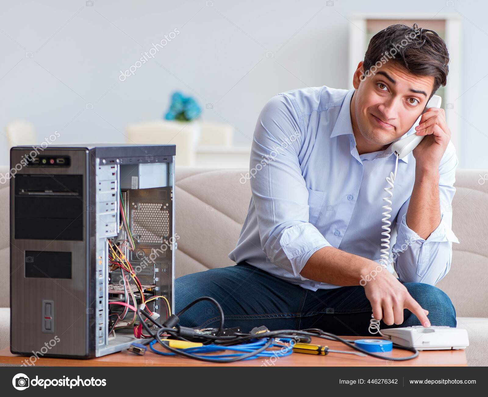 Angry customer trying to repair computer with phone support Stock Photo ...