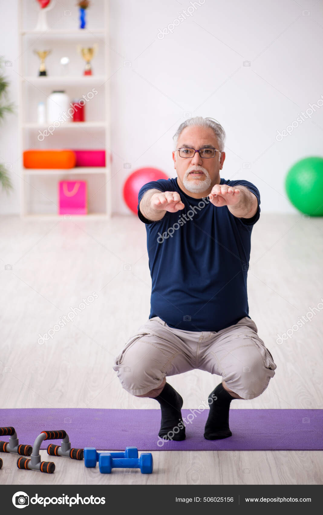 Old man doing sport exercises indoors Stock Photo by ©Elnur_ 506025156