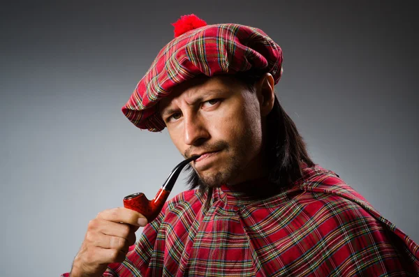 Funny scotsman with smoking pipe Stock Photo by ©Elnur_ 53851079