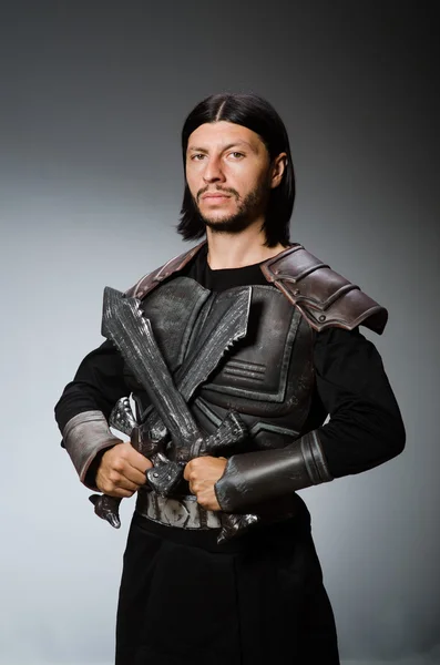 Angry warrior against dark background Stock Photo by ©Elnur_ 57932711