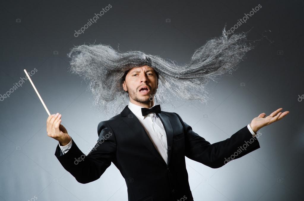 Funny conductor with long grey hair Stock Photo by ©Elnur_ 55847443