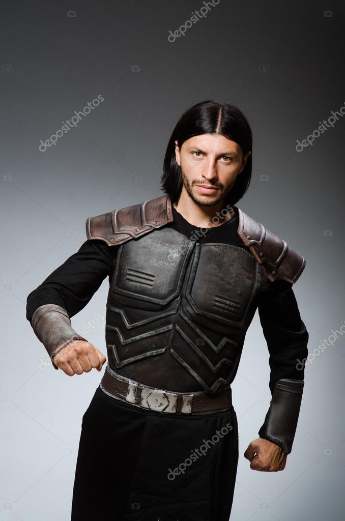 Angry warrior against dark background Stock Photo by ©Elnur_ 57369047