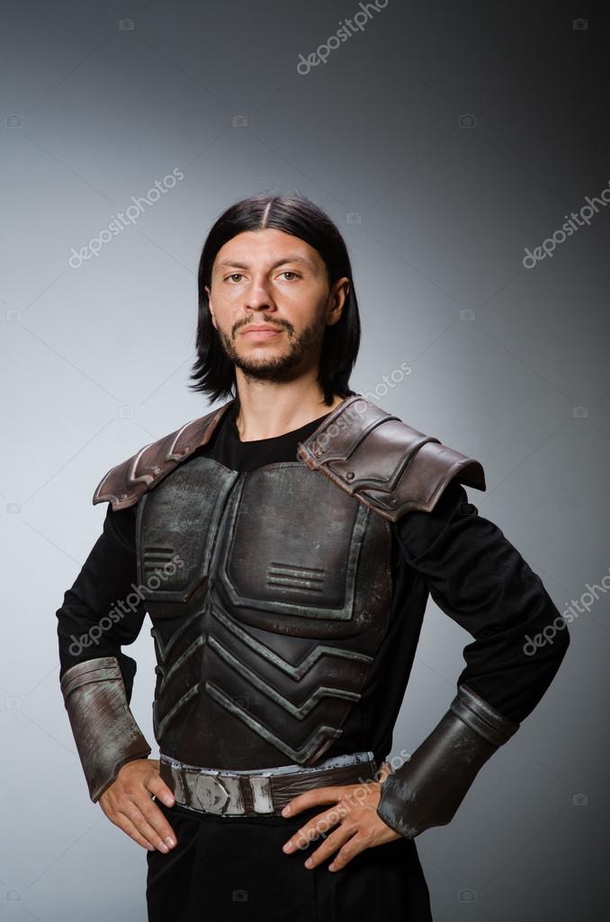 Angry warrior against dark background Stock Photo by ©Elnur_ 57932711