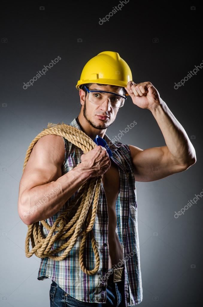 Ripped muscular builder man with tools Stock Photo by ©Elnur_ 57943225