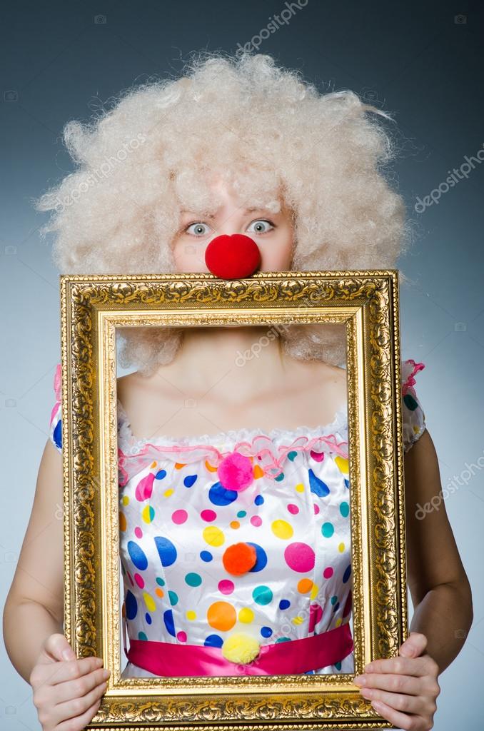Funny clown with picture frame Stock Photo by ©Elnur_ 59175025
