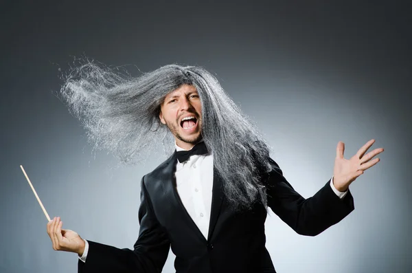 Funny conductor with long grey hair Stock Photo by ©Elnur_ 55847443