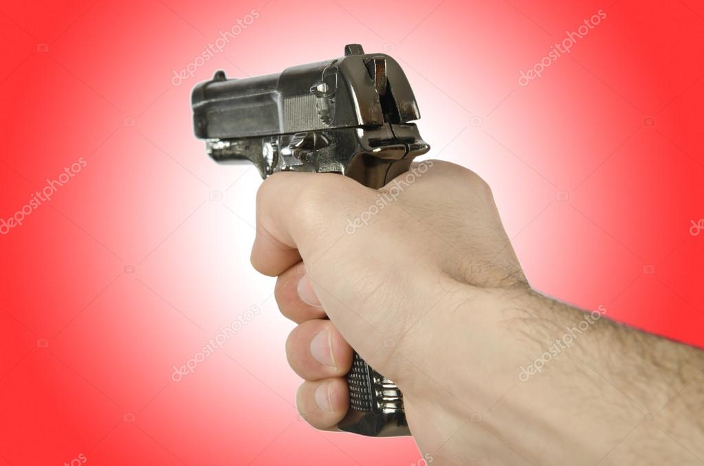 Hand holding gun Stock Photo by ©Elnur_ 67132297