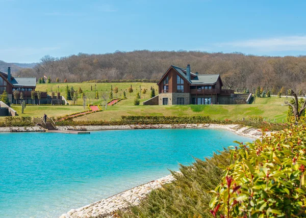 Modern house near water on bright day – Stock Editorial Photo © Elnur ...