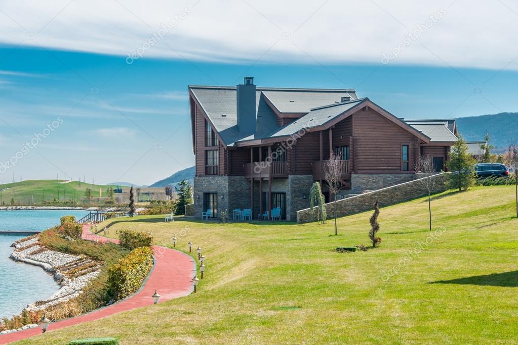 Modern house near water on bright day – Stock Editorial Photo © Elnur ...