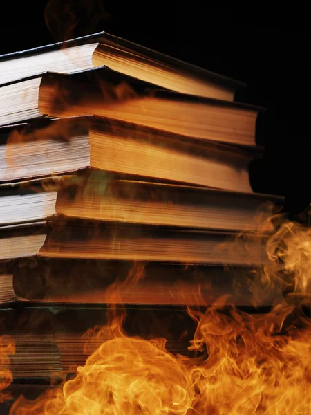 Stack of books in a burning fire - Stock Image - Everypixel