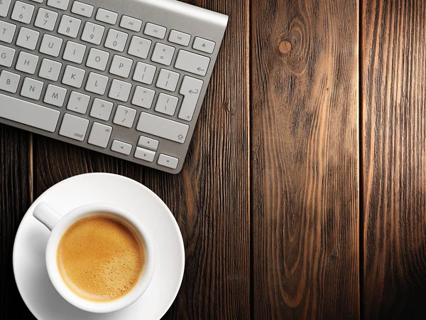 White keyboard and cup of coffee — Stock Photo © Wavebreakmedia #76341787