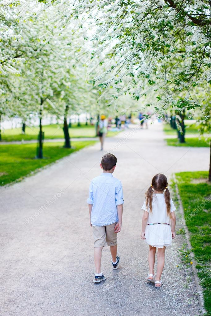 Kids in a spring park Stock Photo by ©shalamov 63209011