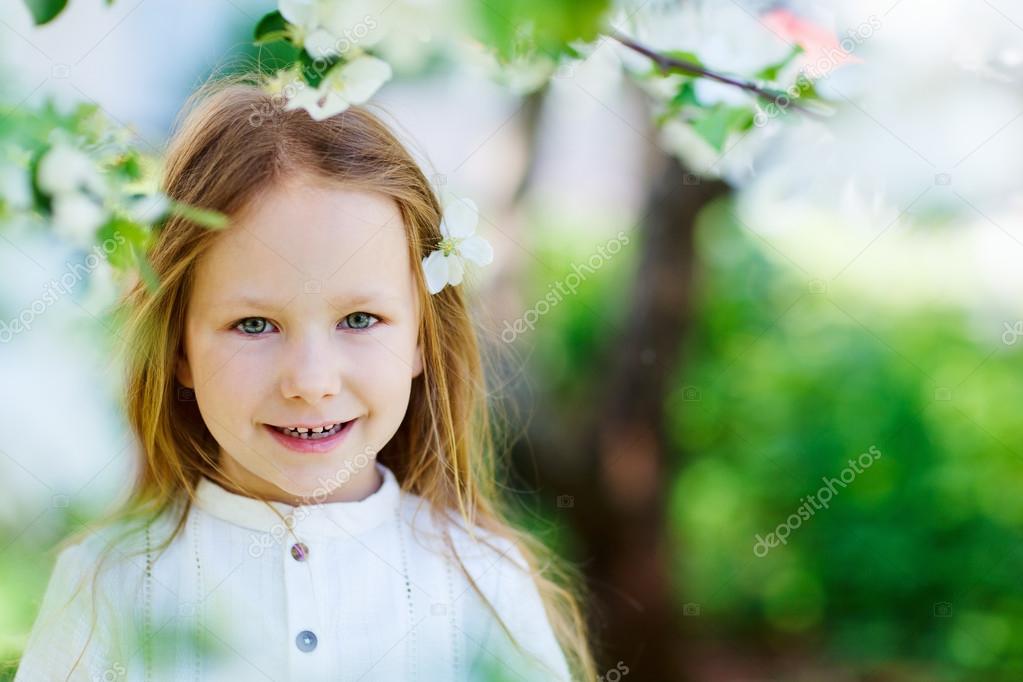 Little girl spring portrait Stock Photo by ©shalamov 63817951