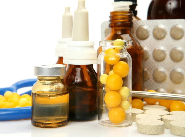 Tablets for treatment of illness Stock Photo by ©Elena777 21270845