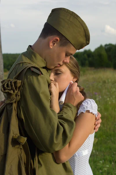 Soviet soldier saying goodbye to girl — Stock Photo © Demian #83436134