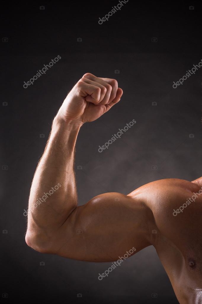 Bodybuilders biceps Stock Photo by ©svyatoslavlipik 84254140