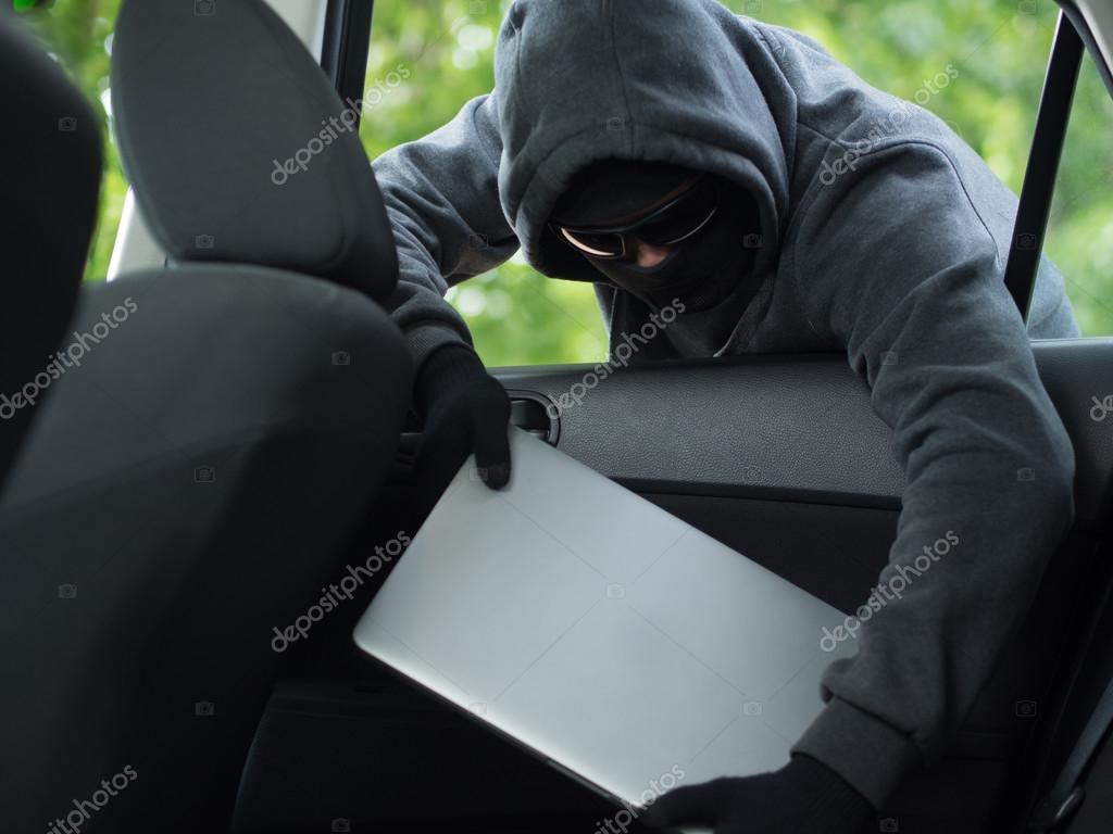 Car theft - a laptop being stolen through the window of an unoccupied ...