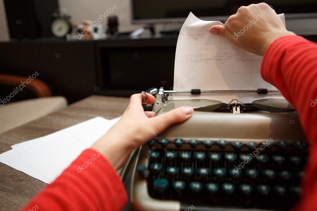 Woman working on typewriter — Stock Photo © logoff #90519886