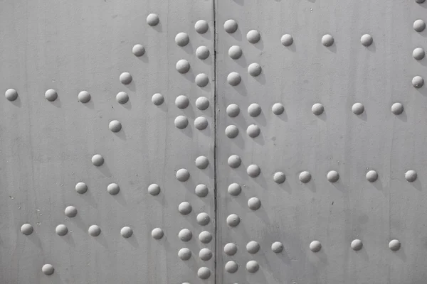 Riveted metal surface — Stock Photo © MADDRAT #51877979
