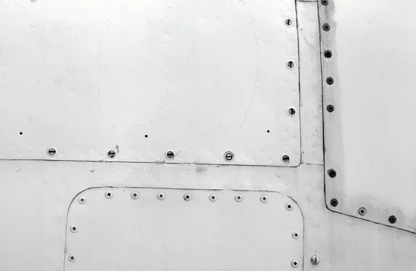 Riveted metal surface — Stock Photo © MADDRAT #51877979