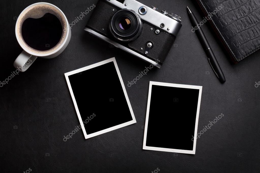 Office desk with photos, camera, — Stock Photo © karandaev #102981144