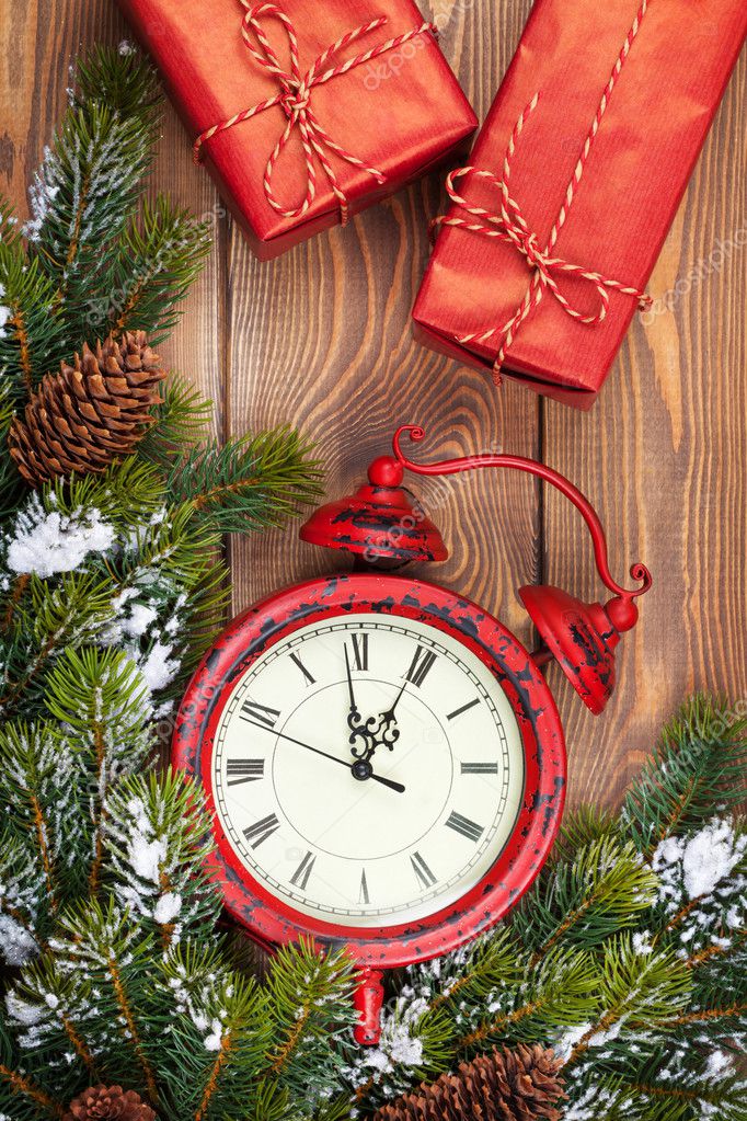 Christmas clock, gifts and fir tree Stock Photo by ©karandaev 57722413